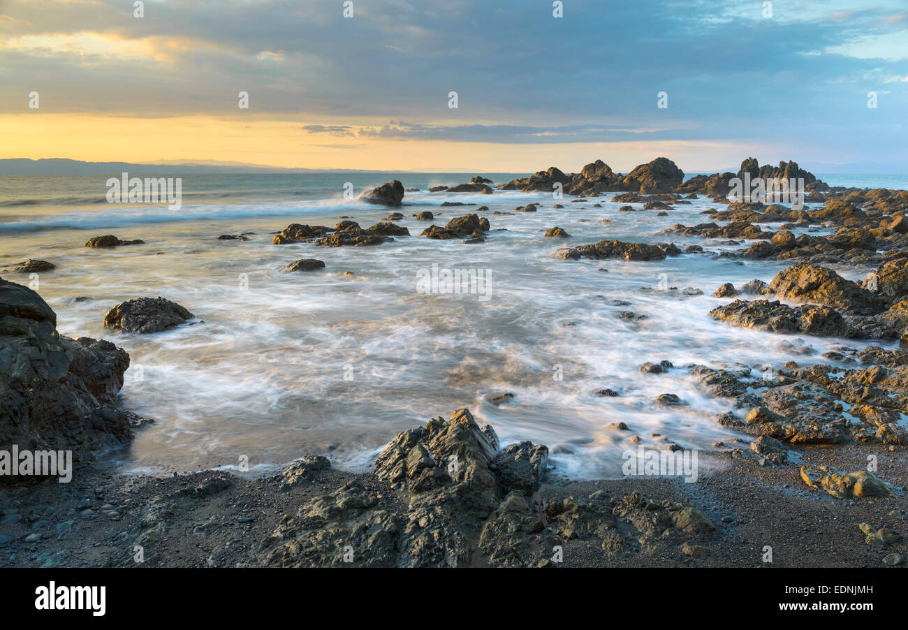 Water over rocks at beach hi-res stock photography and images - Alamy