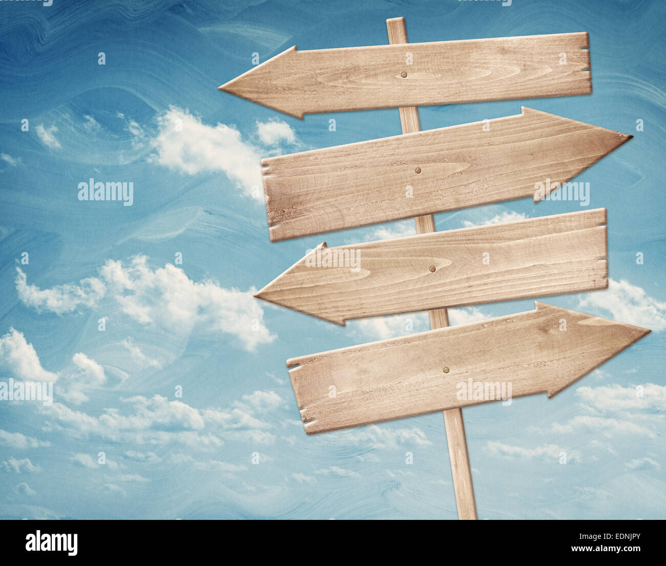 Blank brown wooden signpost against blue sky Stock Photo - Alamy