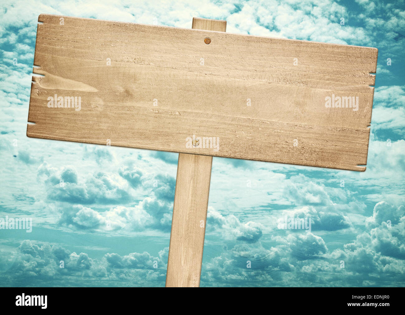 Blank brown wooden signpost against blue sky Stock Photo - Alamy