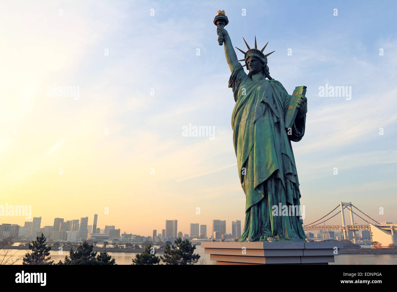 Lady liberty juxtaposed against Rainbow Bridge in Tokyo Stock Photo - Alamy