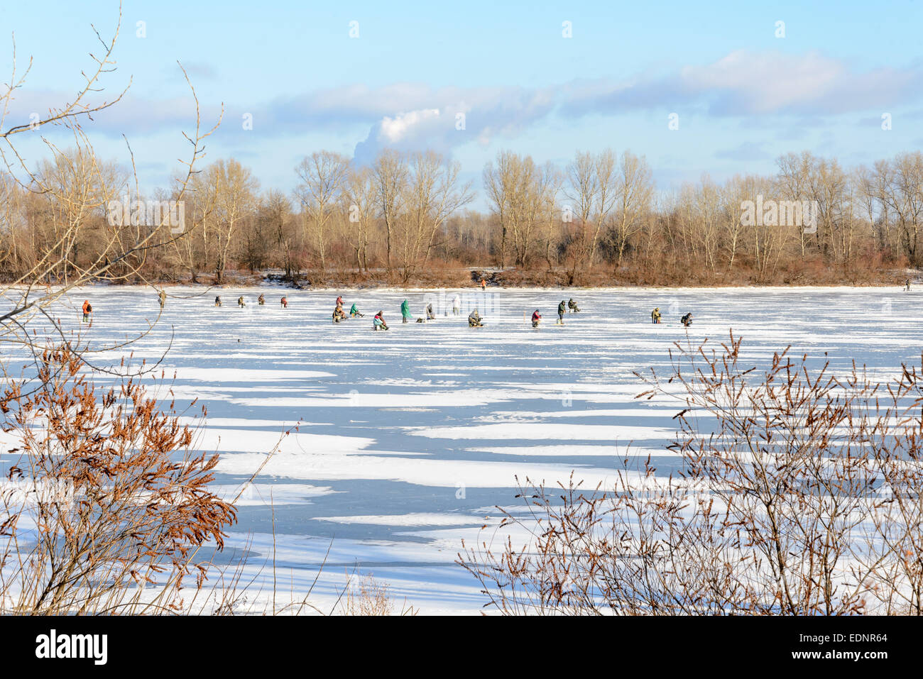 Kiev/Ukraine - January 07, 2015 -The Dnieper river is frozen. Fishermen ...