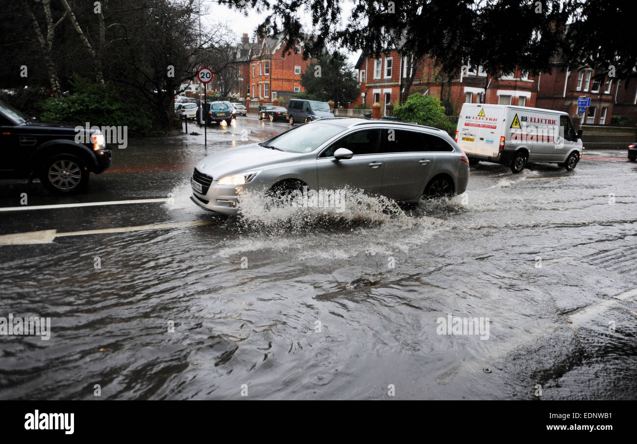 Traffic drives through floodwater in Preston Road Brighton this morning ...