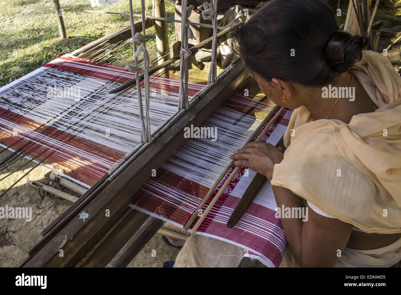 Jan. 8, 2015 - Sivasagar, Assam, India - A woman weaves gamosa ...