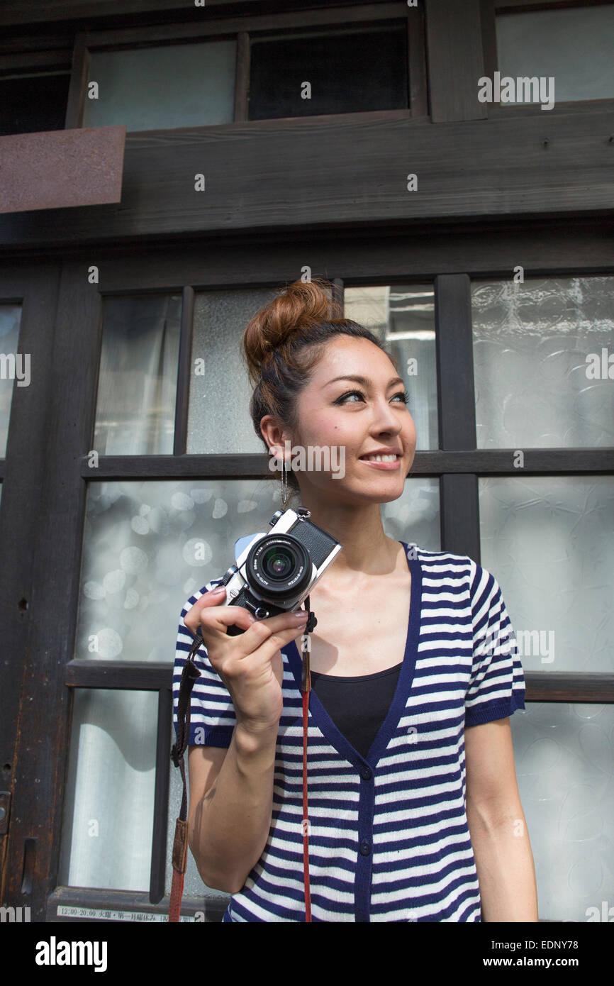Person holding camera hi-res stock photography and images - Alamy