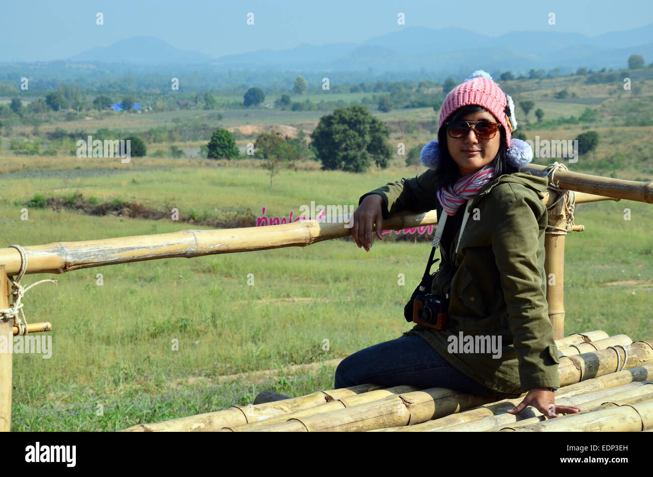 Thai woman sit for rest at Viewpoint in winter season at Ban Kha is a ...