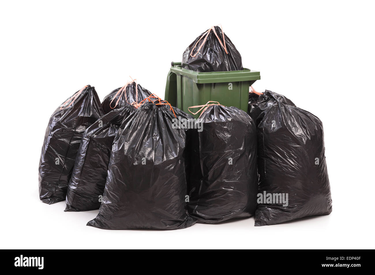 Trash can surrounded by a bunch of garbage bags isolated on white ...