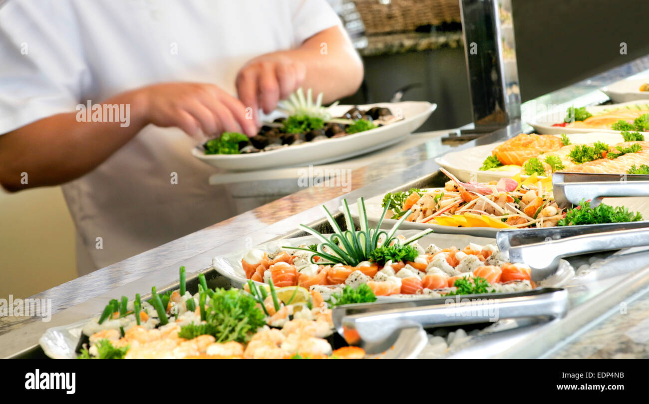 A shallow depth of field image looking along a sushi buffet bar Stock ...