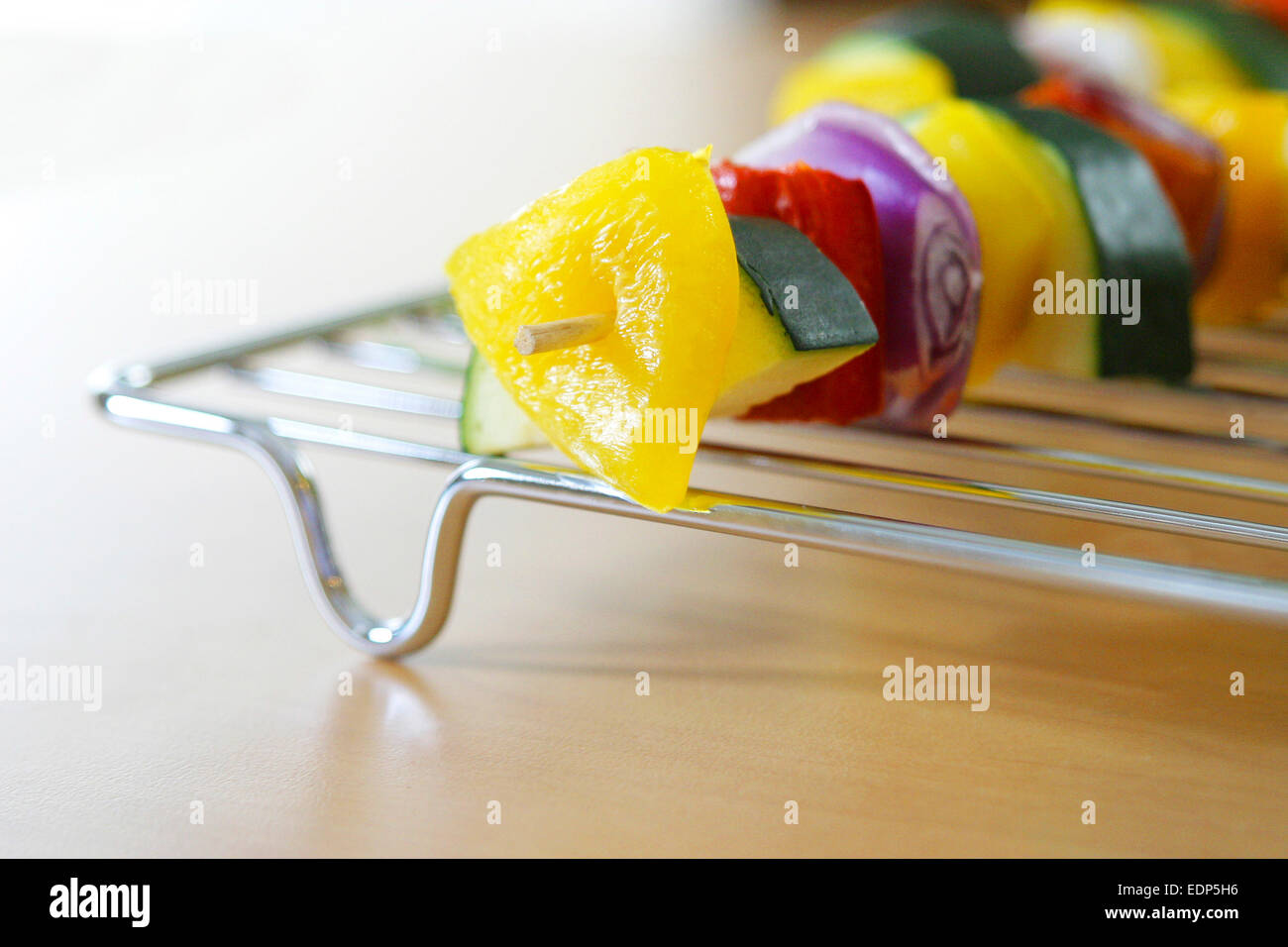 A close up of a vegetable kebab on a rack on a kitchen worktop Stock ...