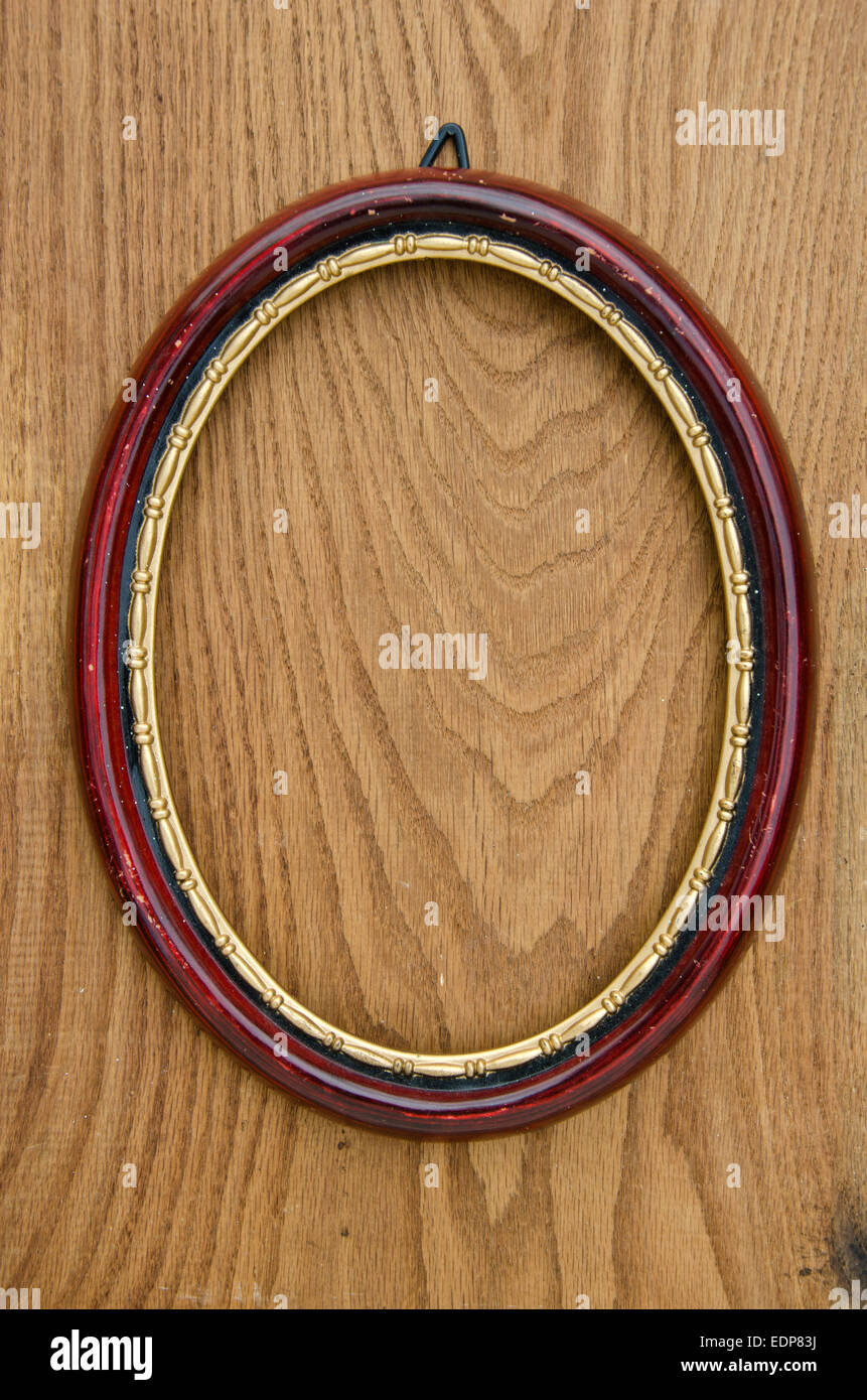 vintage empty oval picture art frame on oak plank background Stock ...