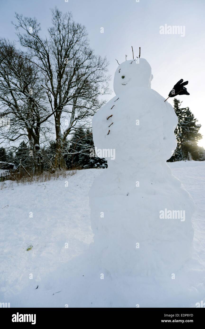 A snowman in the winter landscape, Germany, near city of Sonnenberg in ...