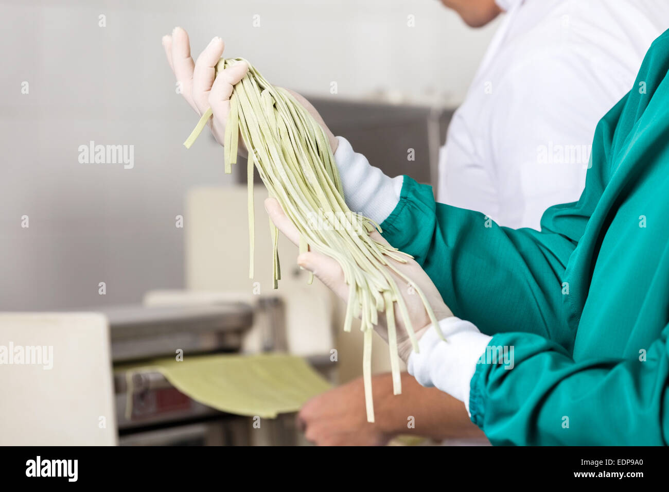 Male Chef Holding Spaghetti Pasta At Kitchen Stock Photo - Alamy