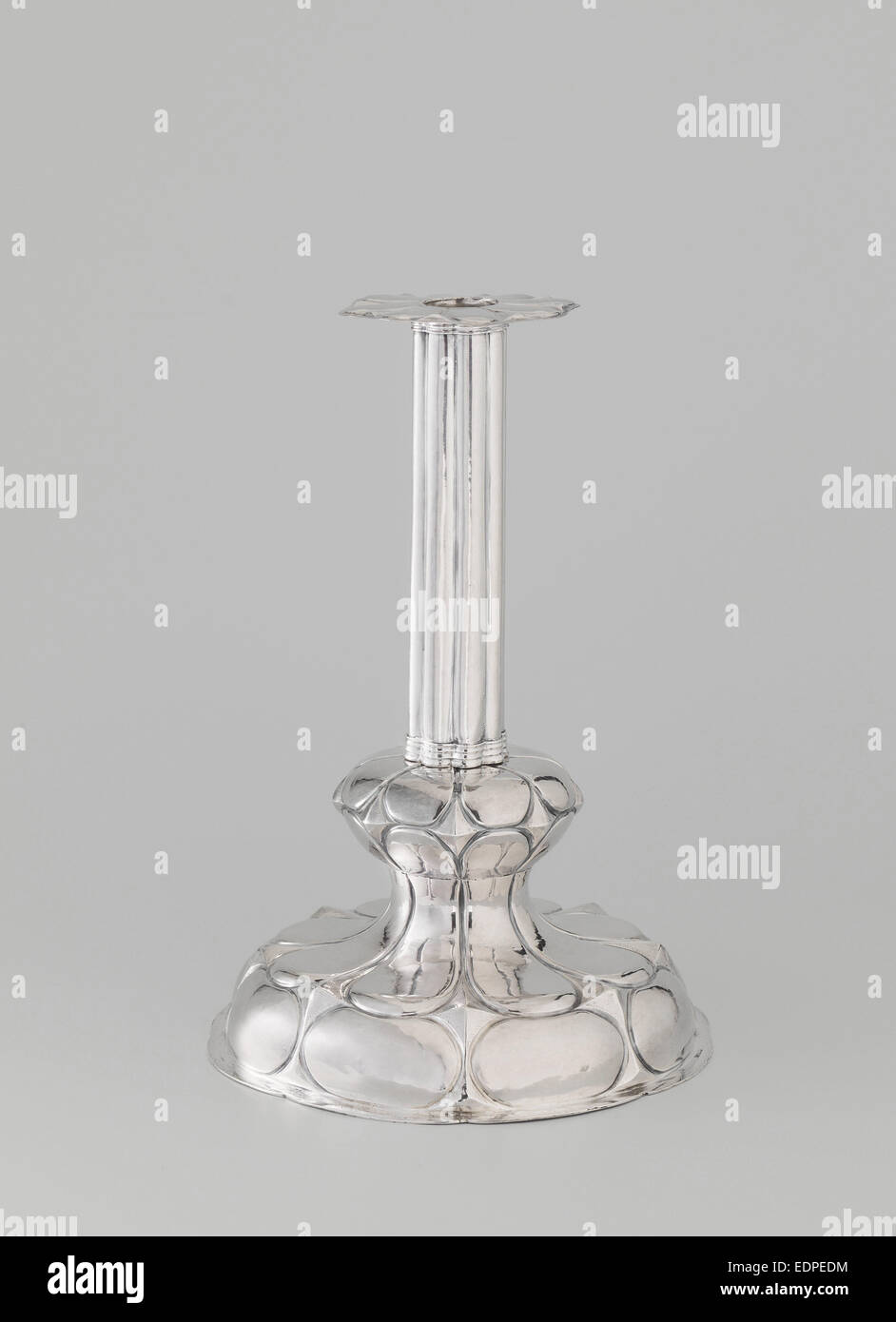Candlestick with stem and a curved base with eight ovals and Godron ...