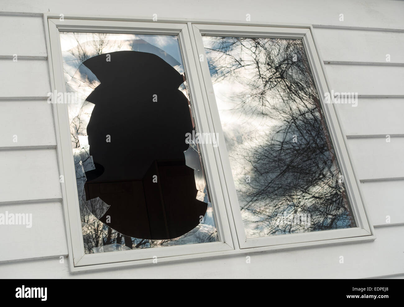 vandalized broken window on house Stock Photo - Alamy