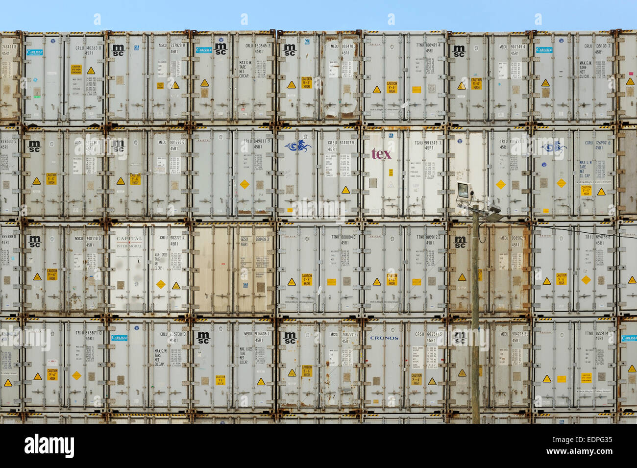 Stacked Containers in Storage Depot Stock Photo - Alamy