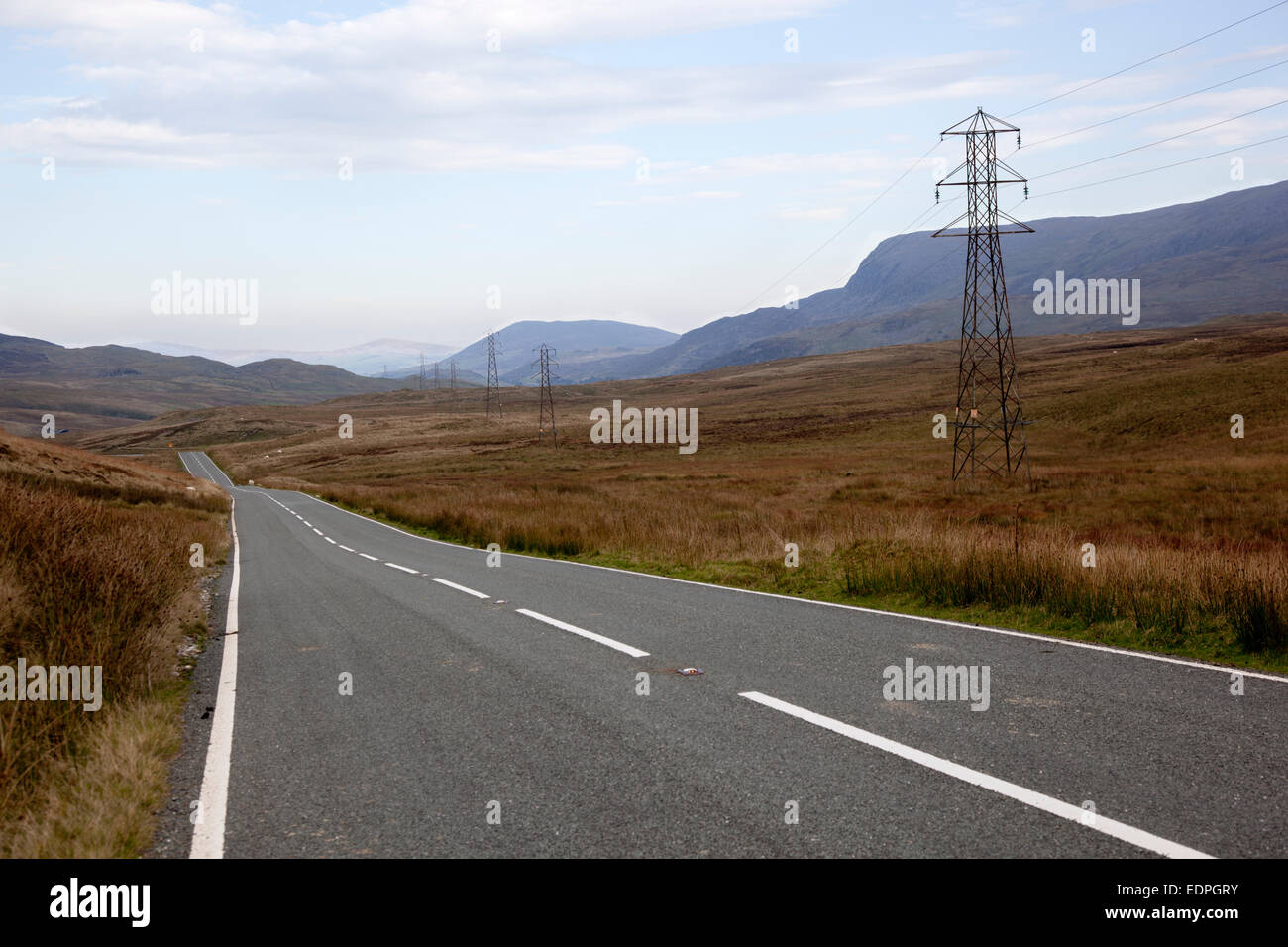 A line of power pylons on the Migneint moorland of North Wales viewed ...