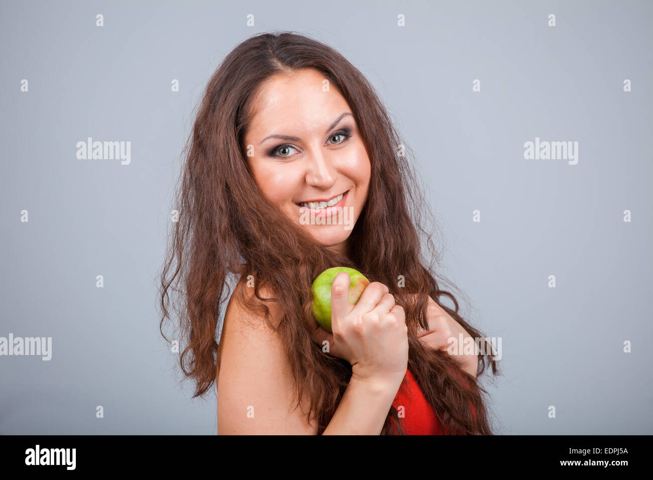 Smiling Girl and apple Stock Photo - Alamy