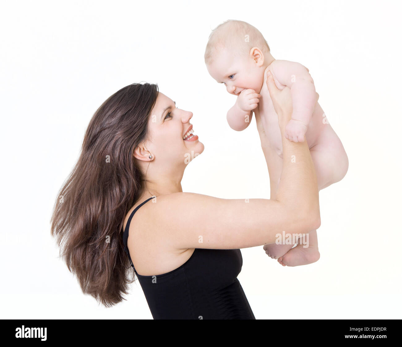 mother is looking forward about baby and lifts it in the air Stock ...