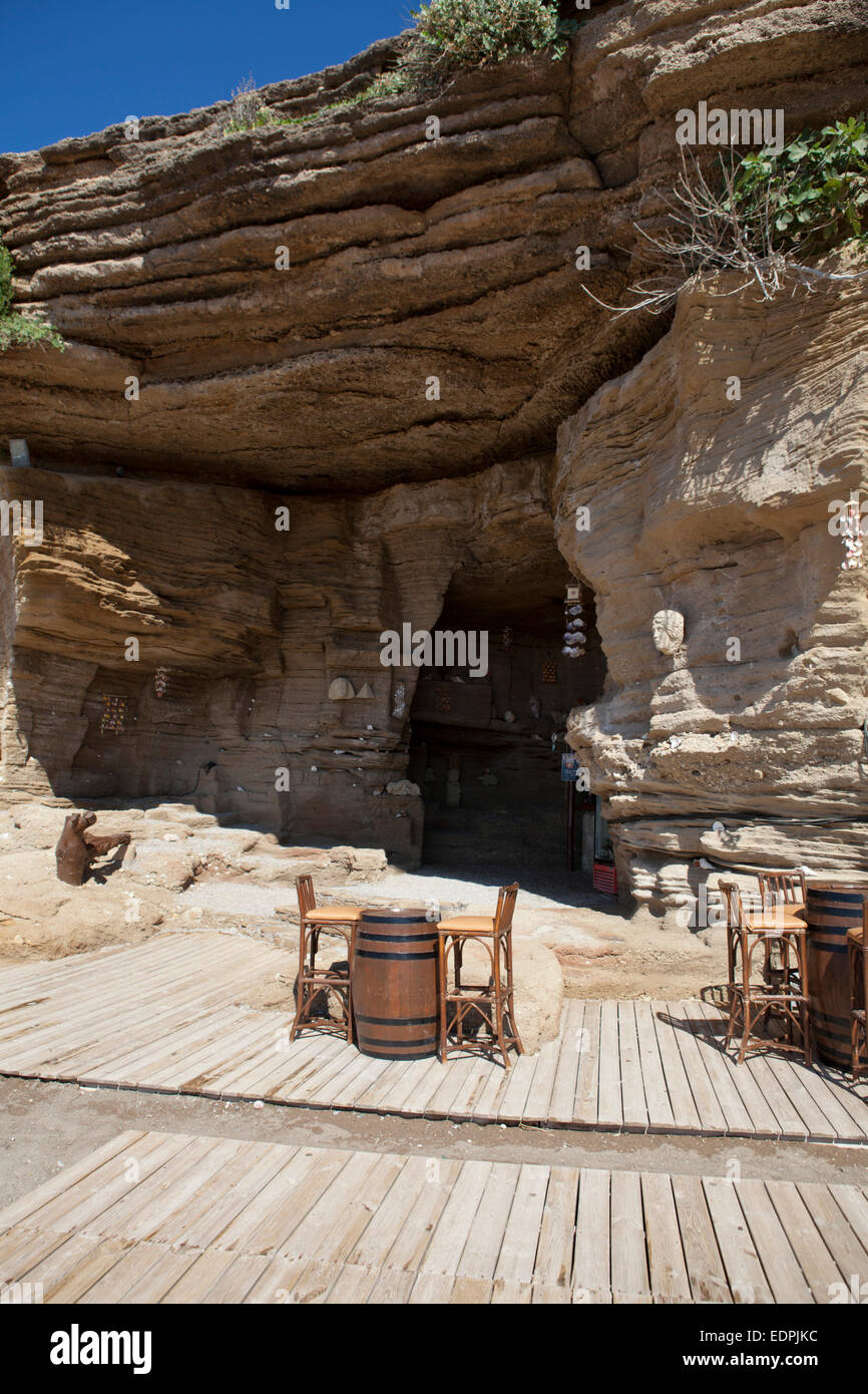Oasis beach cavern inside a cliff wall used as a bar, Rhodes island ...
