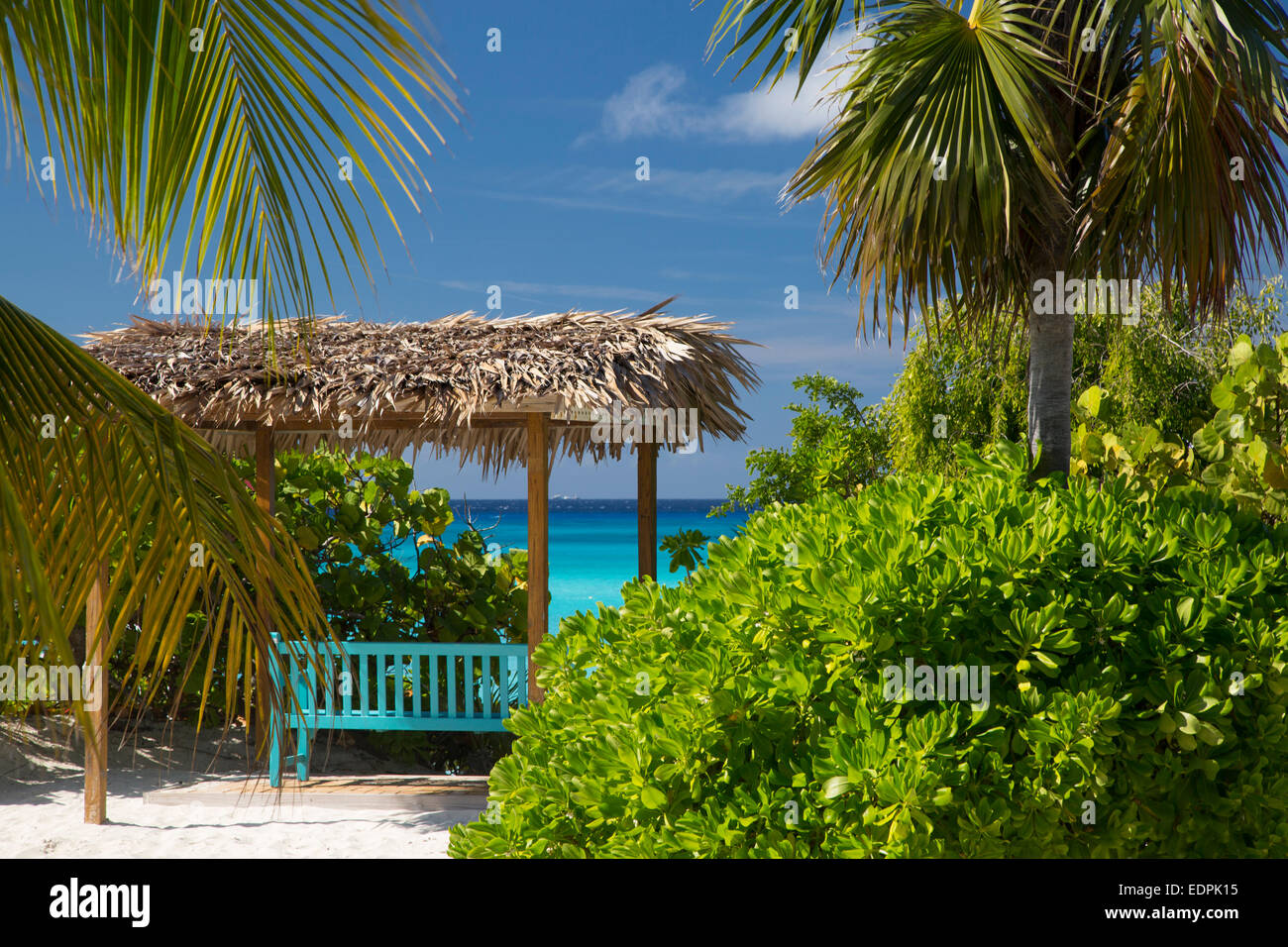 Shady bench seat overlooking turquoise waters of Half Moon Cay, Bahamas ...