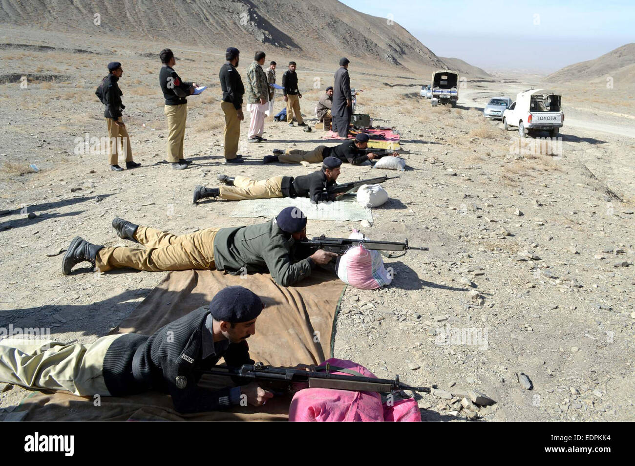 Police guards pointing their aim during training at firing range of ...