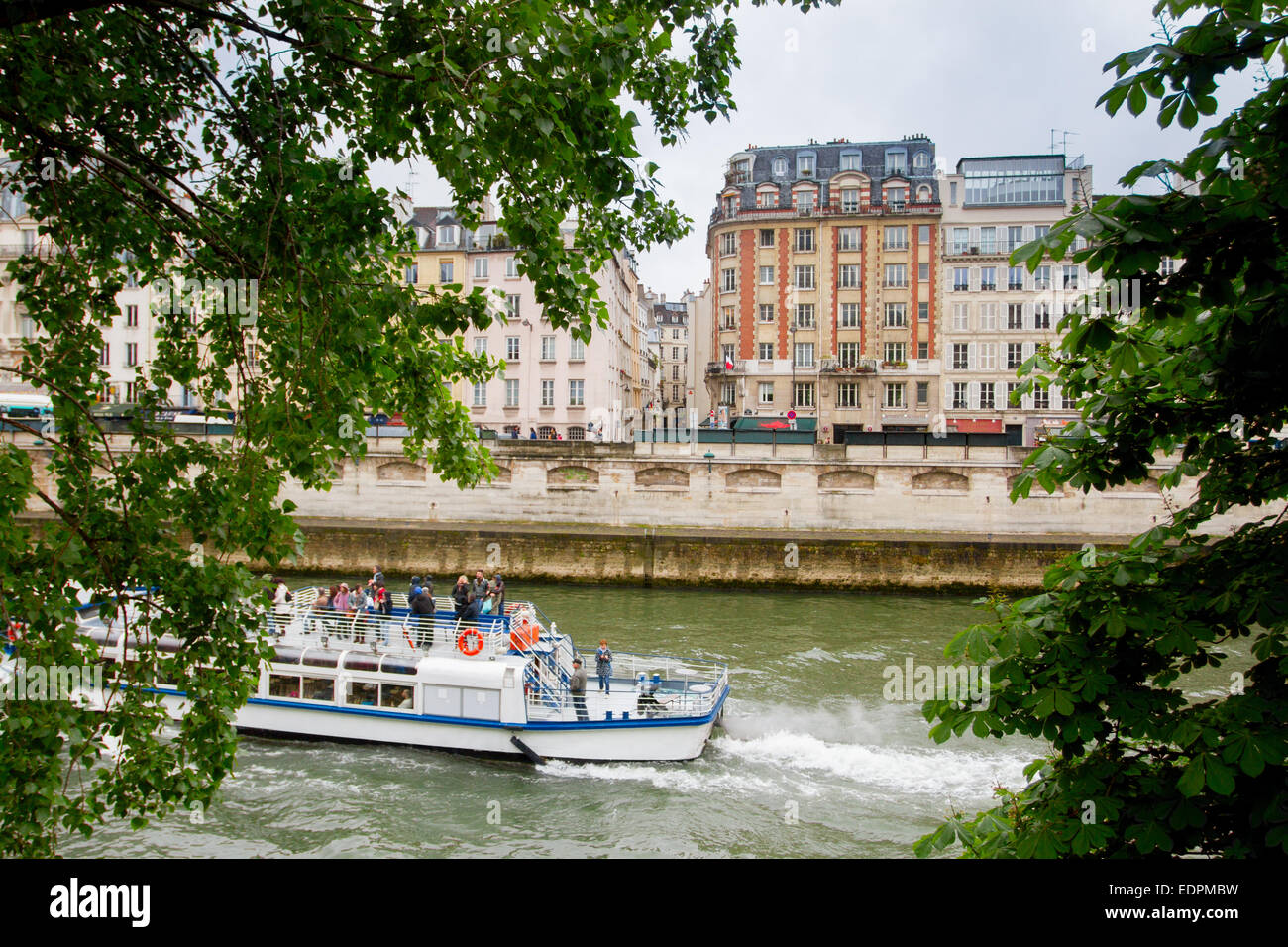 Boat navigating Sena river, Paris Stock Photo - Alamy