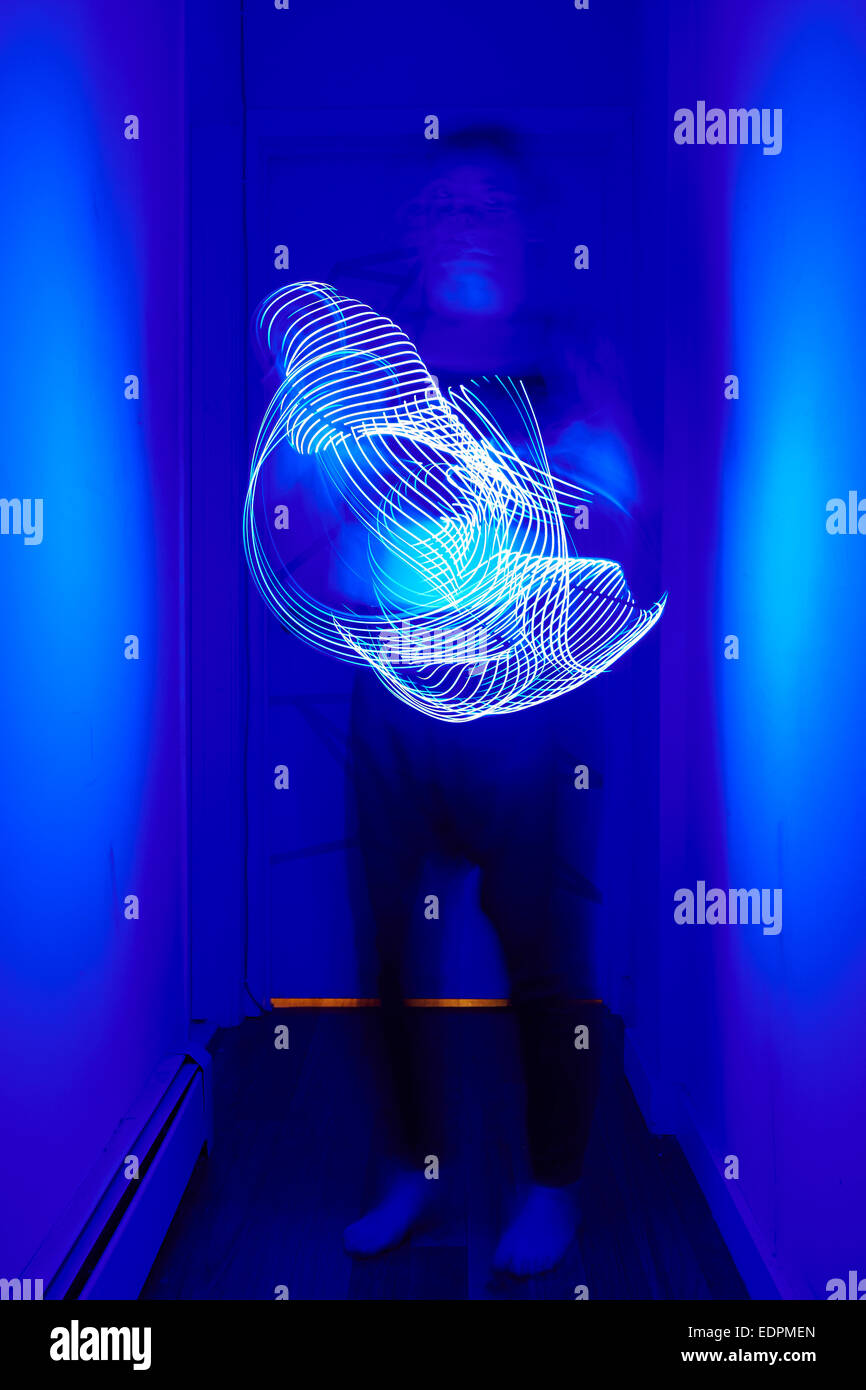 Whimsical light painting forms with LED light stick Stock Photo - Alamy