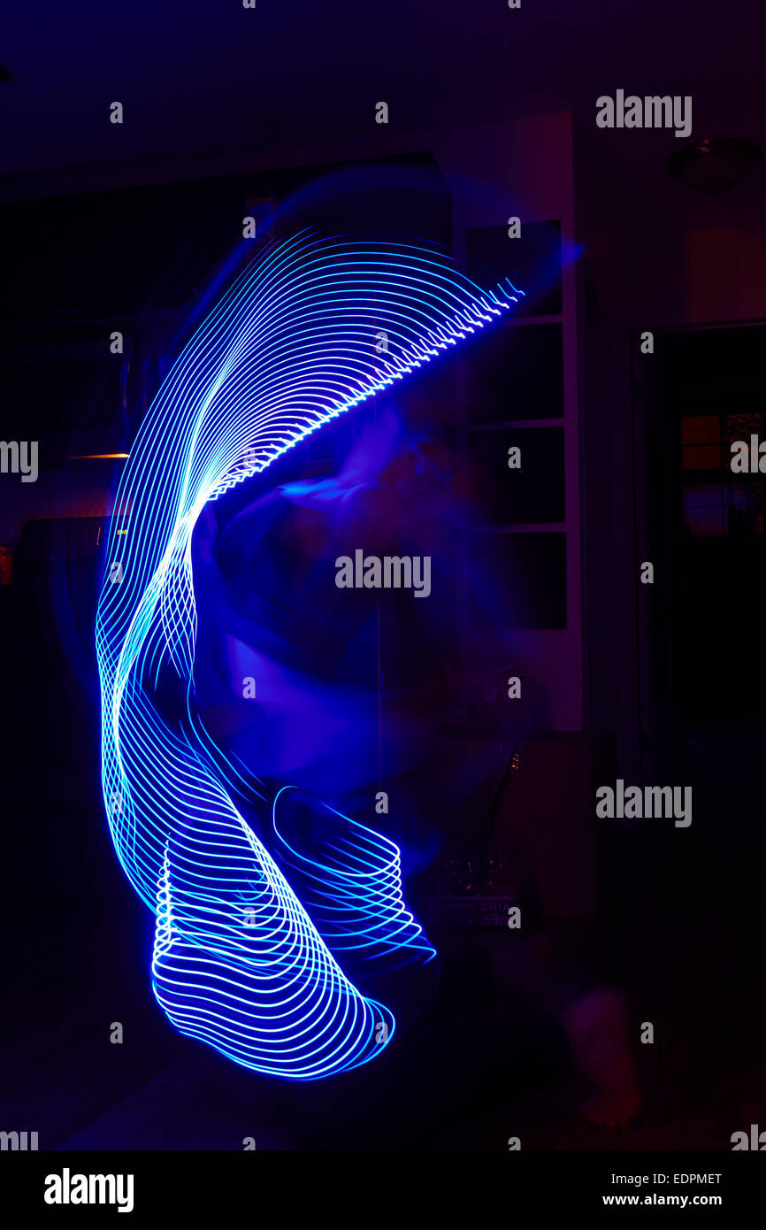Whimsical light painting forms with LED light stick Stock Photo - Alamy