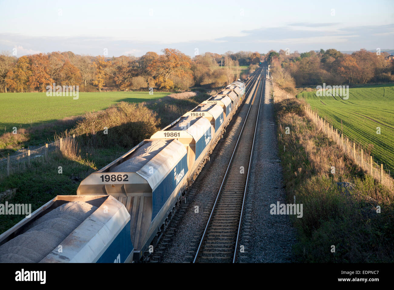 Open wagons of freight train on the West Coast mainline at Woodborough ...