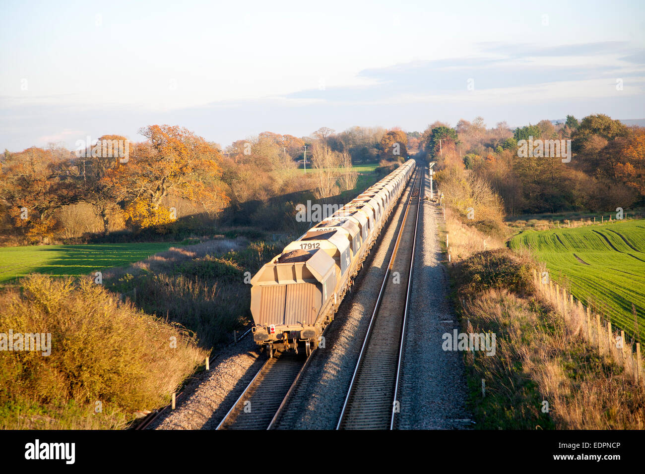 Open wagons of freight train on the West Coast mainline at Woodborough ...