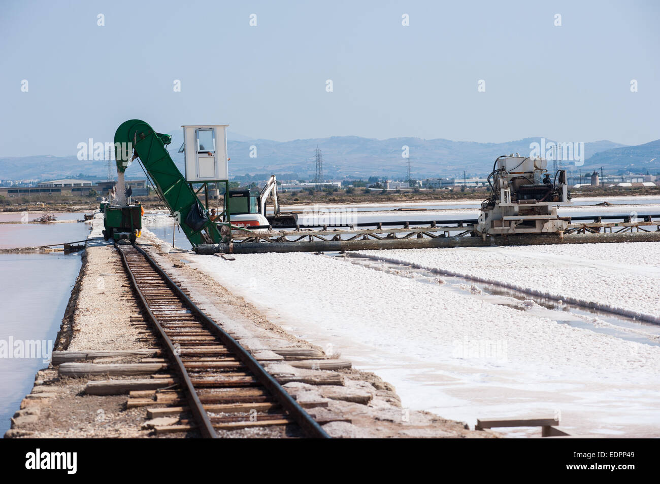 salt collecting in a salt farm Stock Photo - Alamy