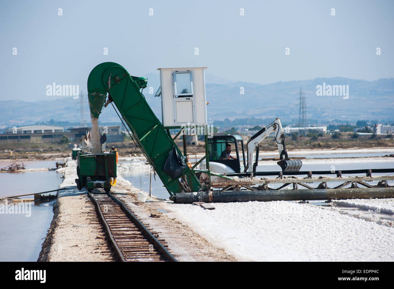 salt collecting in a salt farm Stock Photo - Alamy