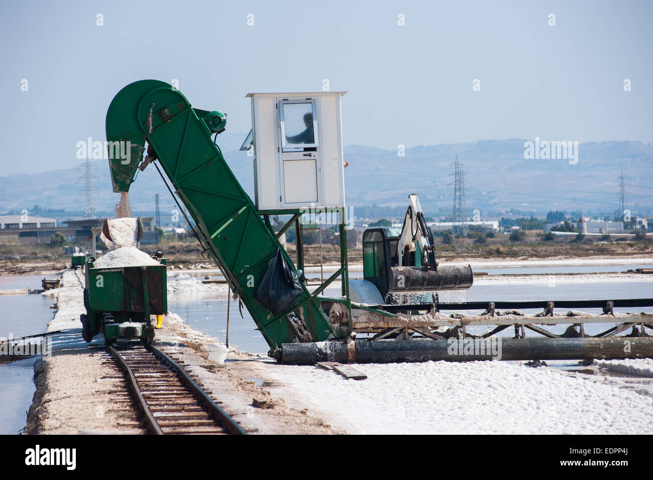 salt collecting in a salt farm Stock Photo - Alamy