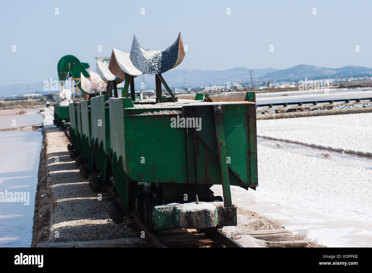salt collecting in a salt farm Stock Photo - Alamy