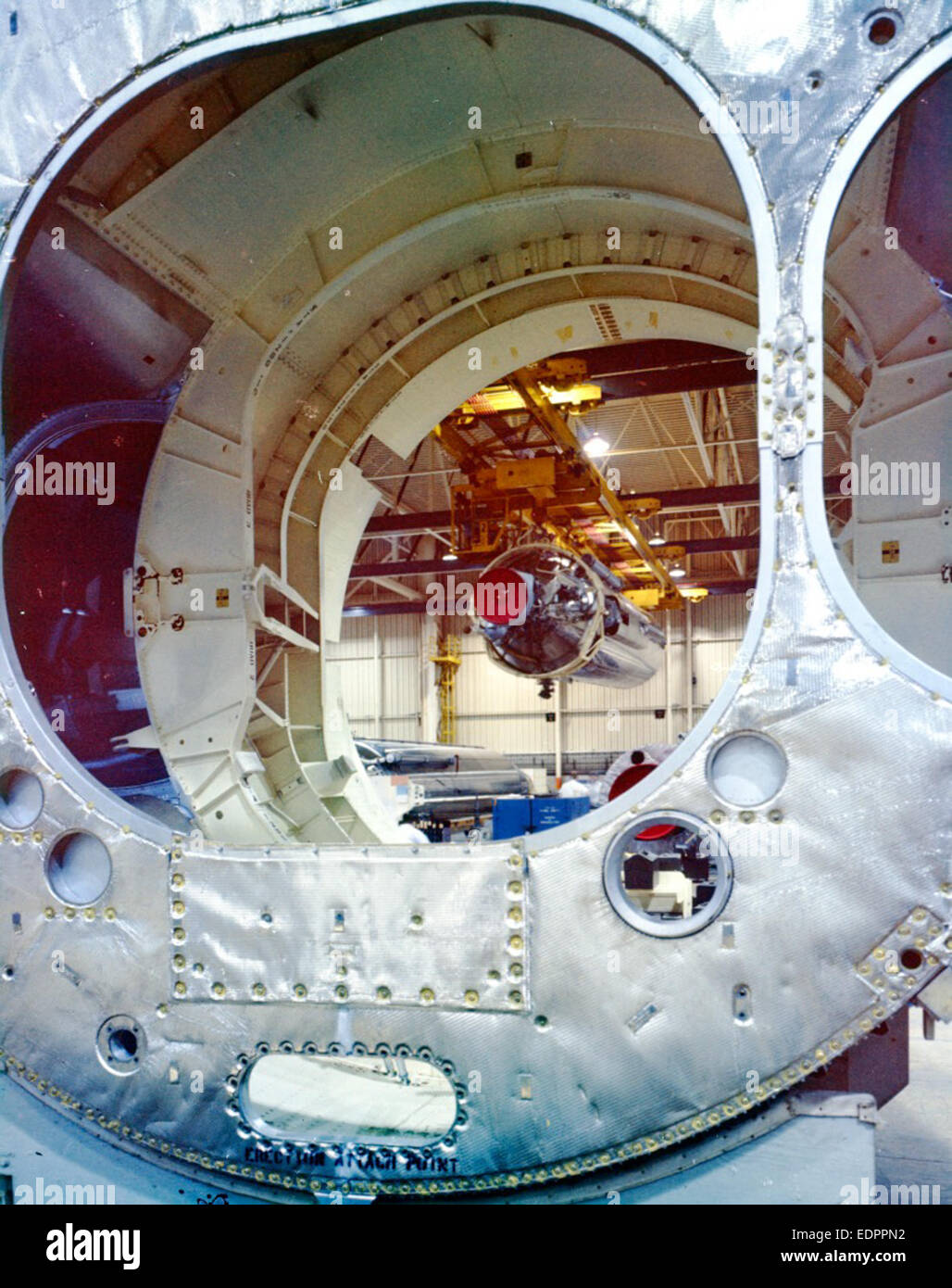 This image shows the assembly of the Atlas ICBM at a factory, with the ...