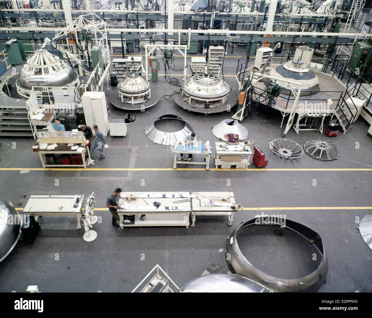 This image shows the assembly process of the Atlas rocket at a factory ...