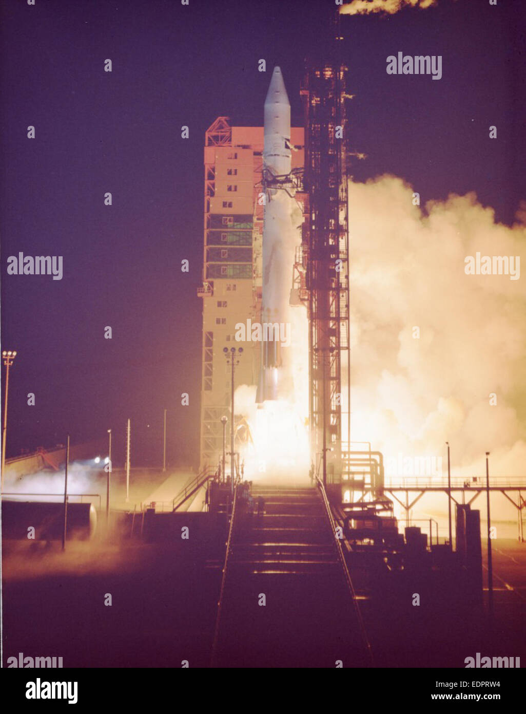 This image captures the Atlas-Centaur rocket launch at night, an ...