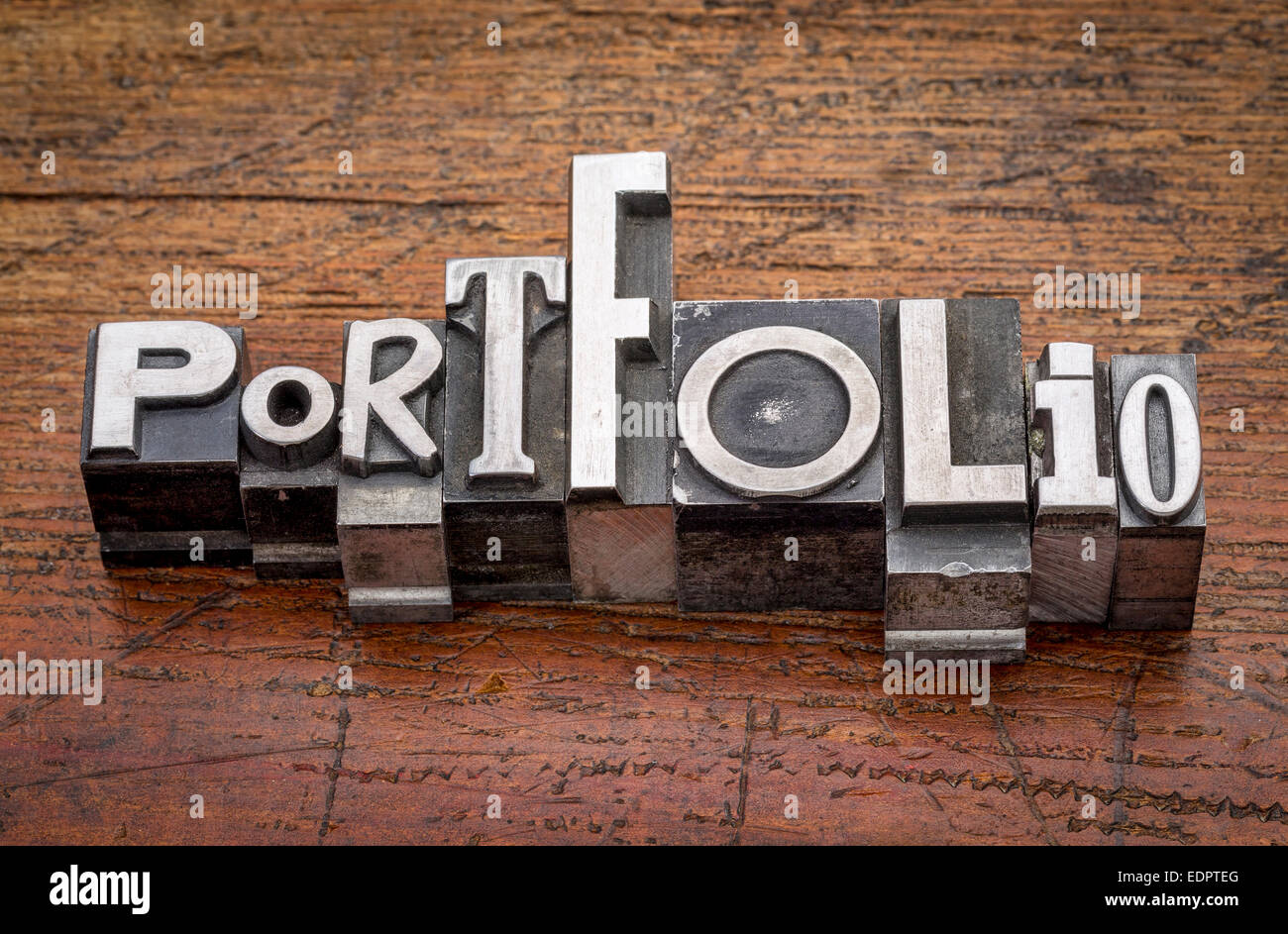 portfolio word in mixed vintage metal type printing blocks over grunge ...
