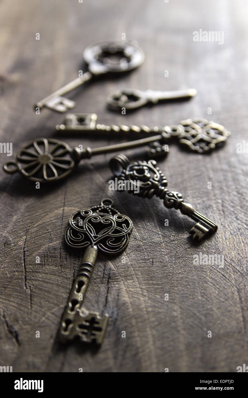 bunch of vintage keys on old wooden plank Stock Photo - Alamy