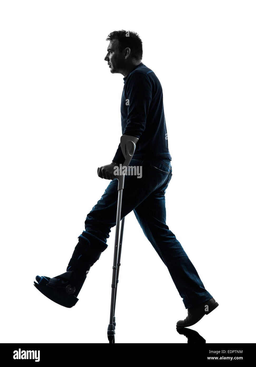 one man injured man walking with crutches in silhouette studio on white ...