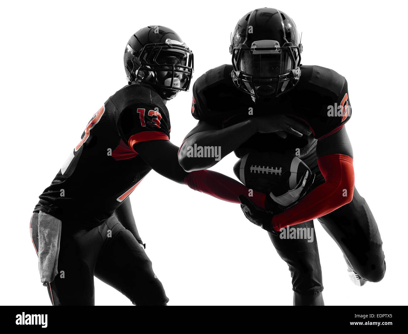 two american football players passing play action in silhouette shadow ...