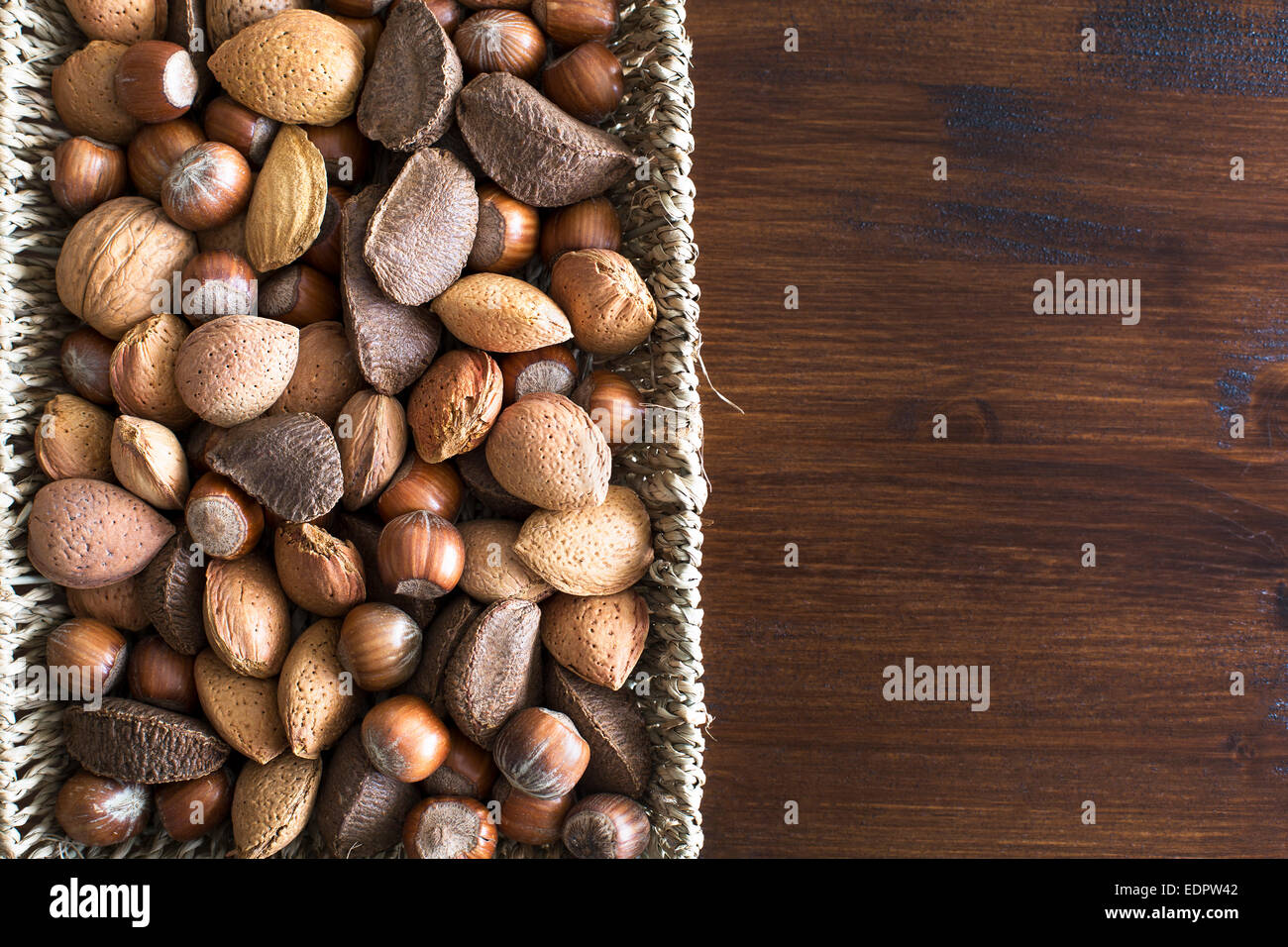 Basket of whole nuts in shell with copy space, can be used vertically ...