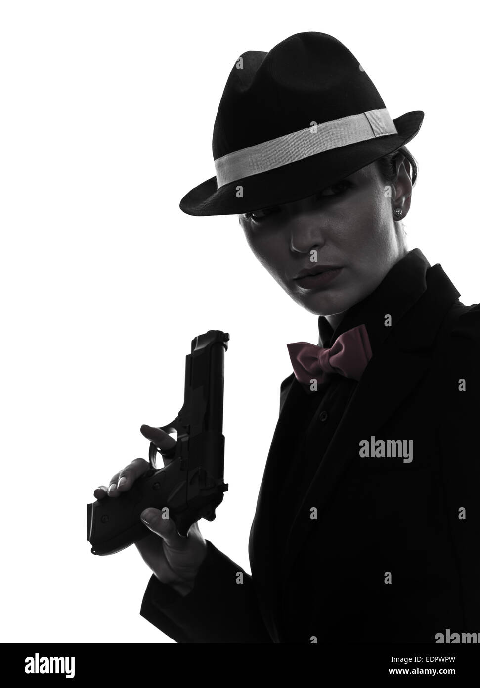 one stylish woman in suit holding gun in silhouette on white background ...