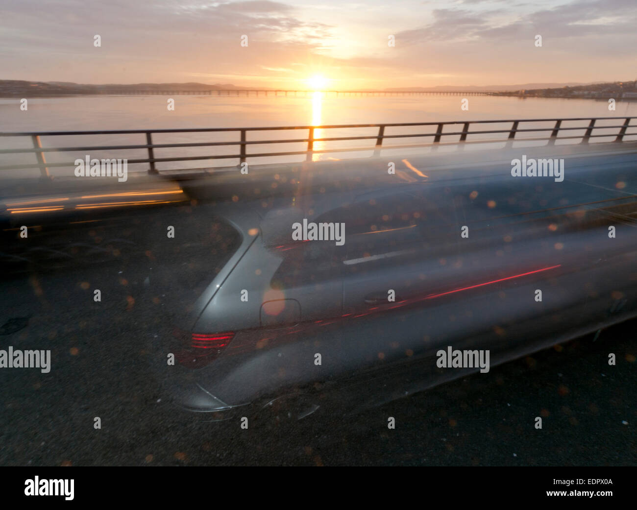 golden car passing blurred angus tay road bridge Stock Photo - Alamy