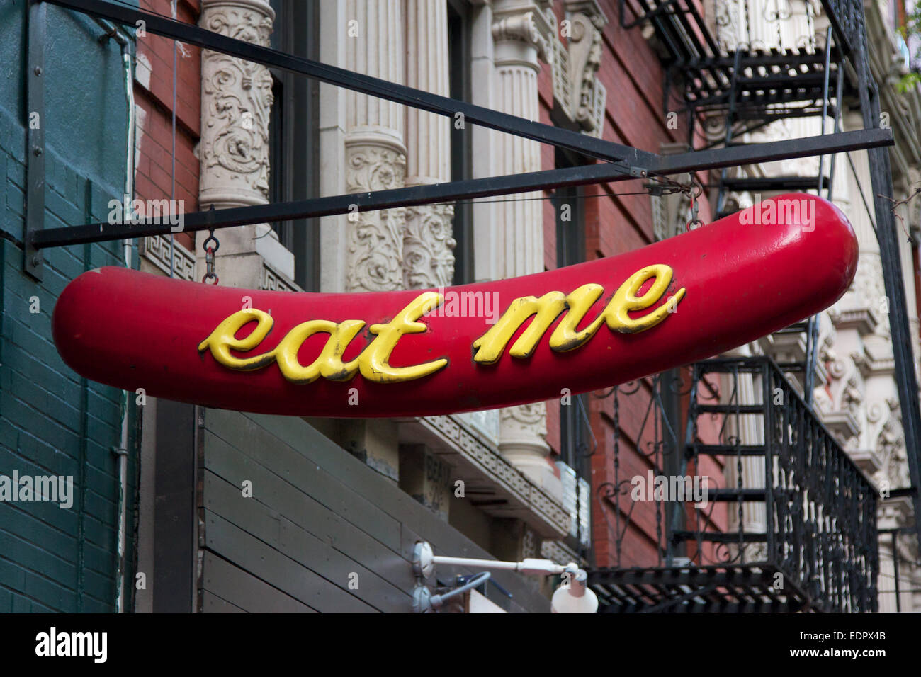 Sign in the form of a sausage reading "eat me" at a building in the ...