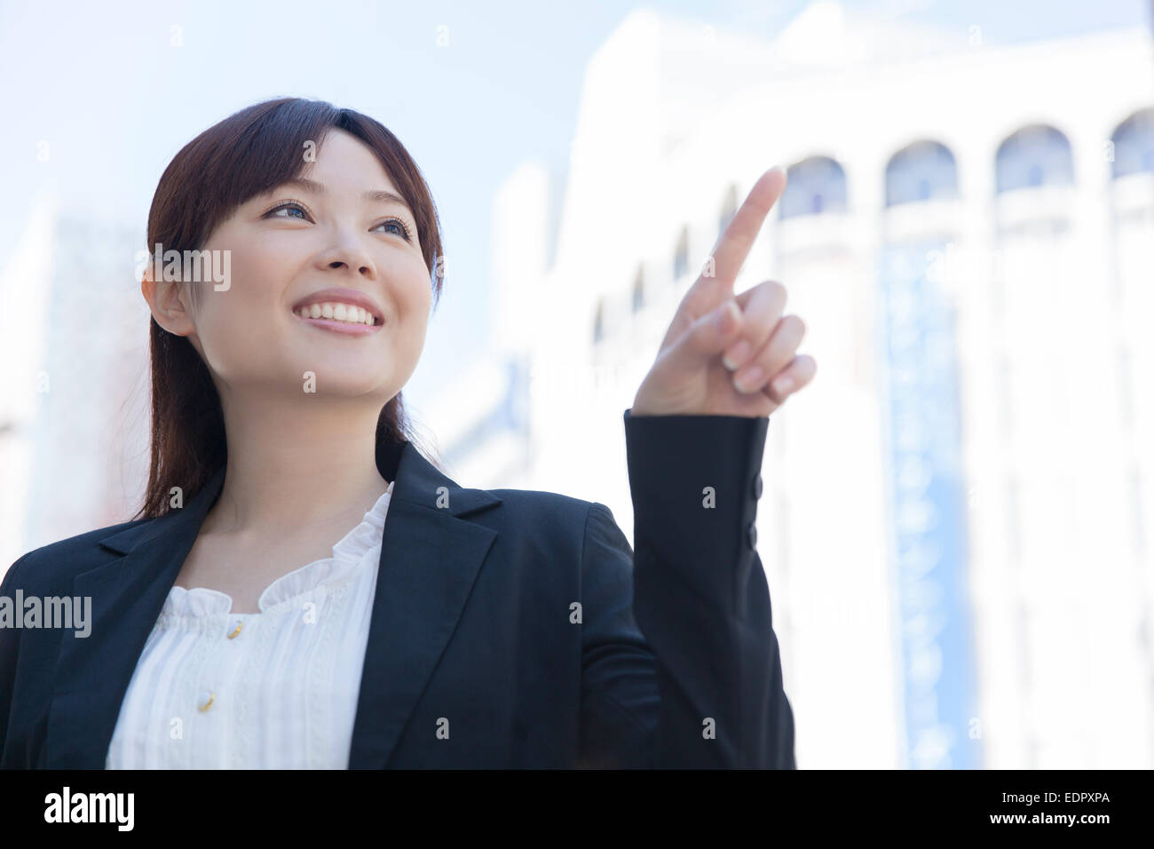 Looking away standing pointing smiling hi-res stock photography and ...