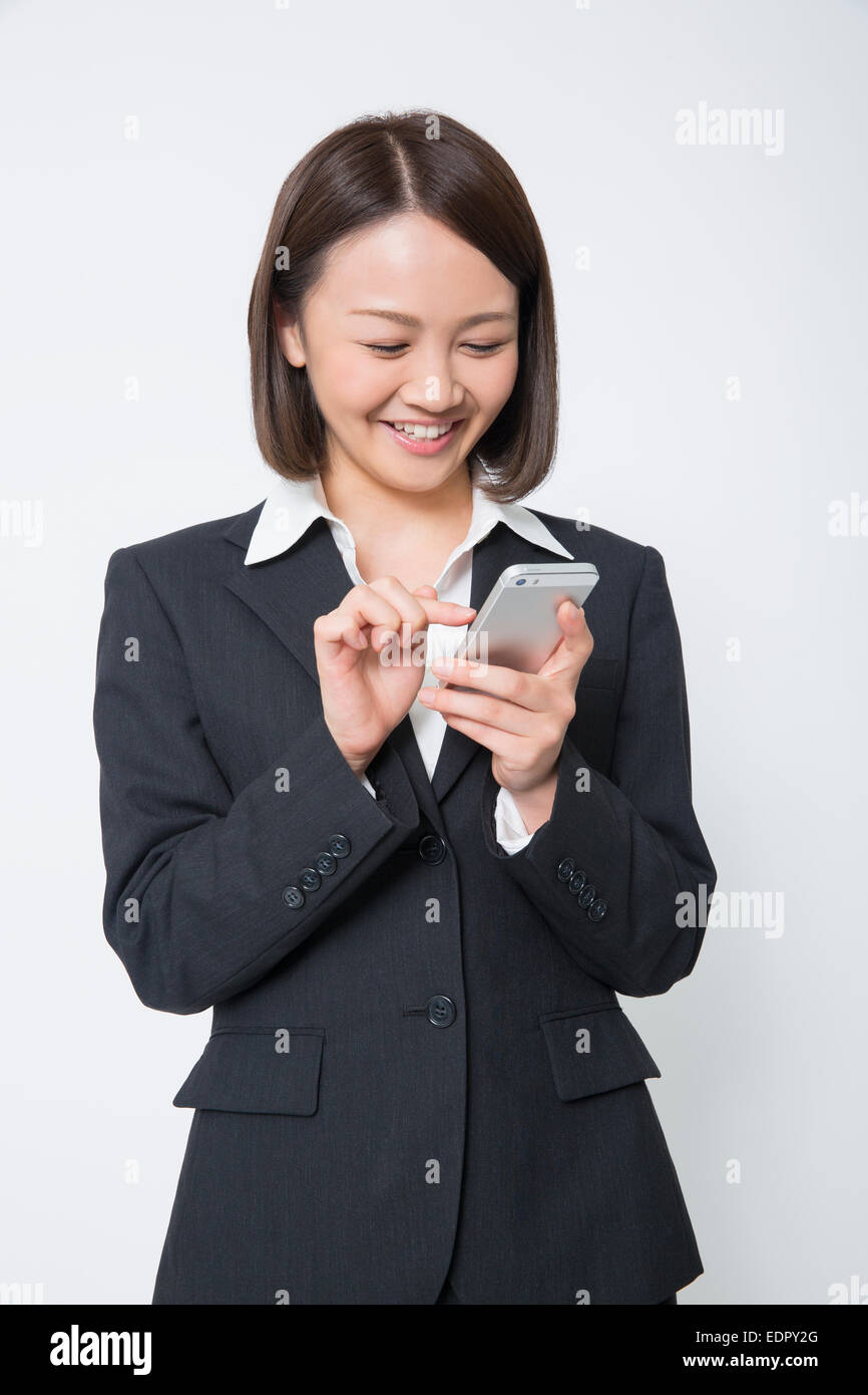 Businesswoman Using Mobile Phone Stock Photo - Alamy