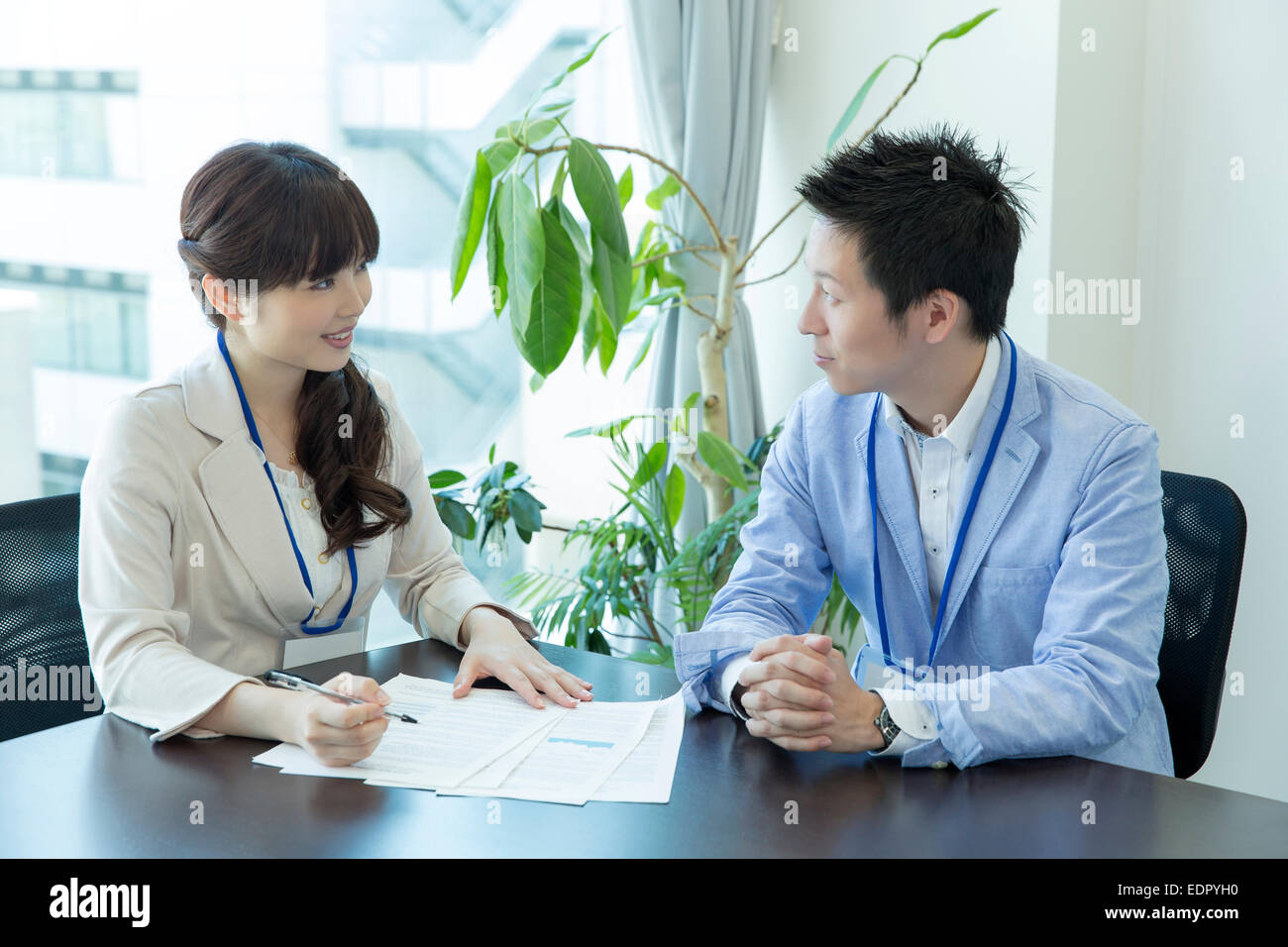 Two Business People in Meeting Stock Photo - Alamy