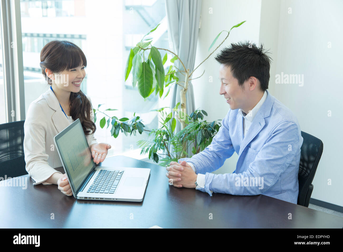 Two Business People in Meeting Stock Photo - Alamy