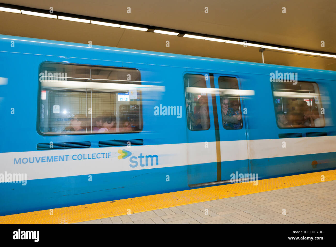 Montreal subway train leaving a station Stock Photo - Alamy