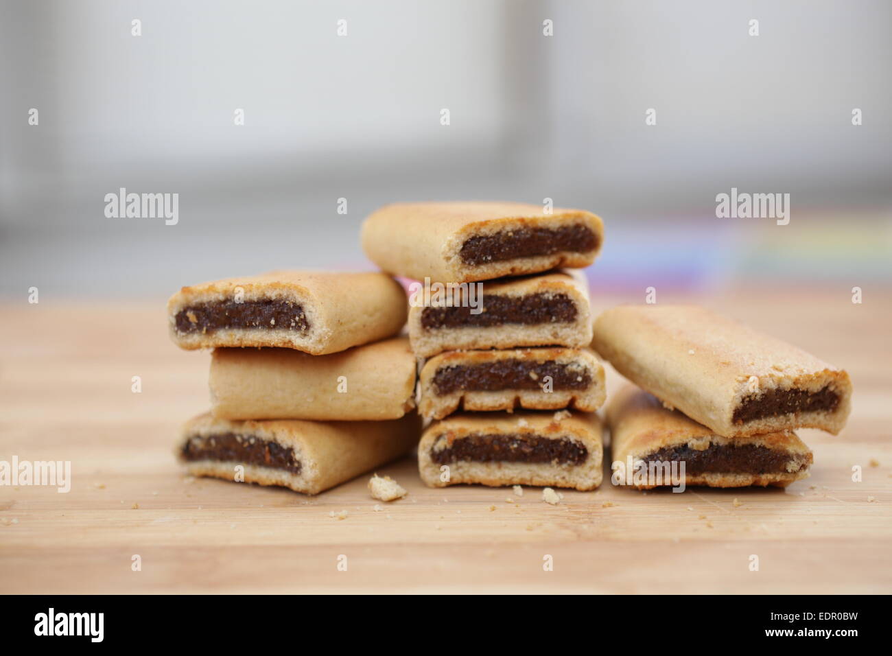 Stack of original fig newtons on a wooden cutting board Stock Photo - Alamy